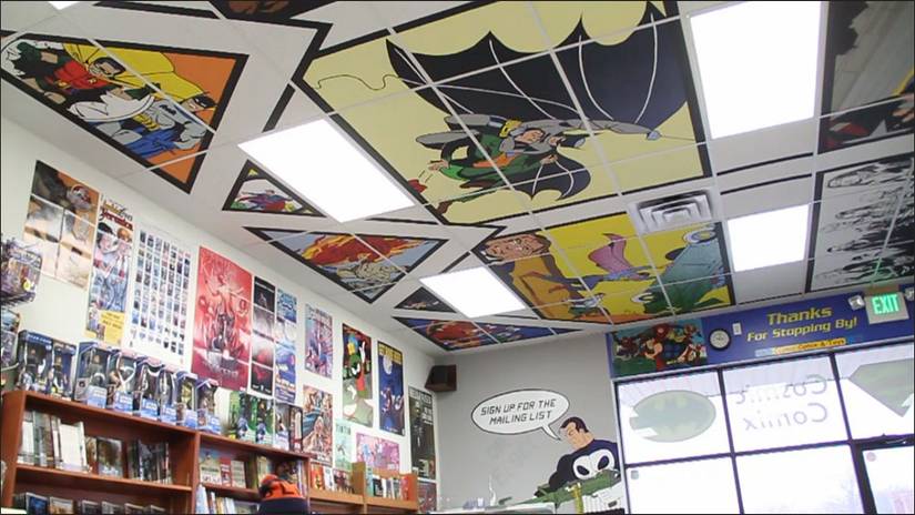 Artist plasters store's ceiling with comics history